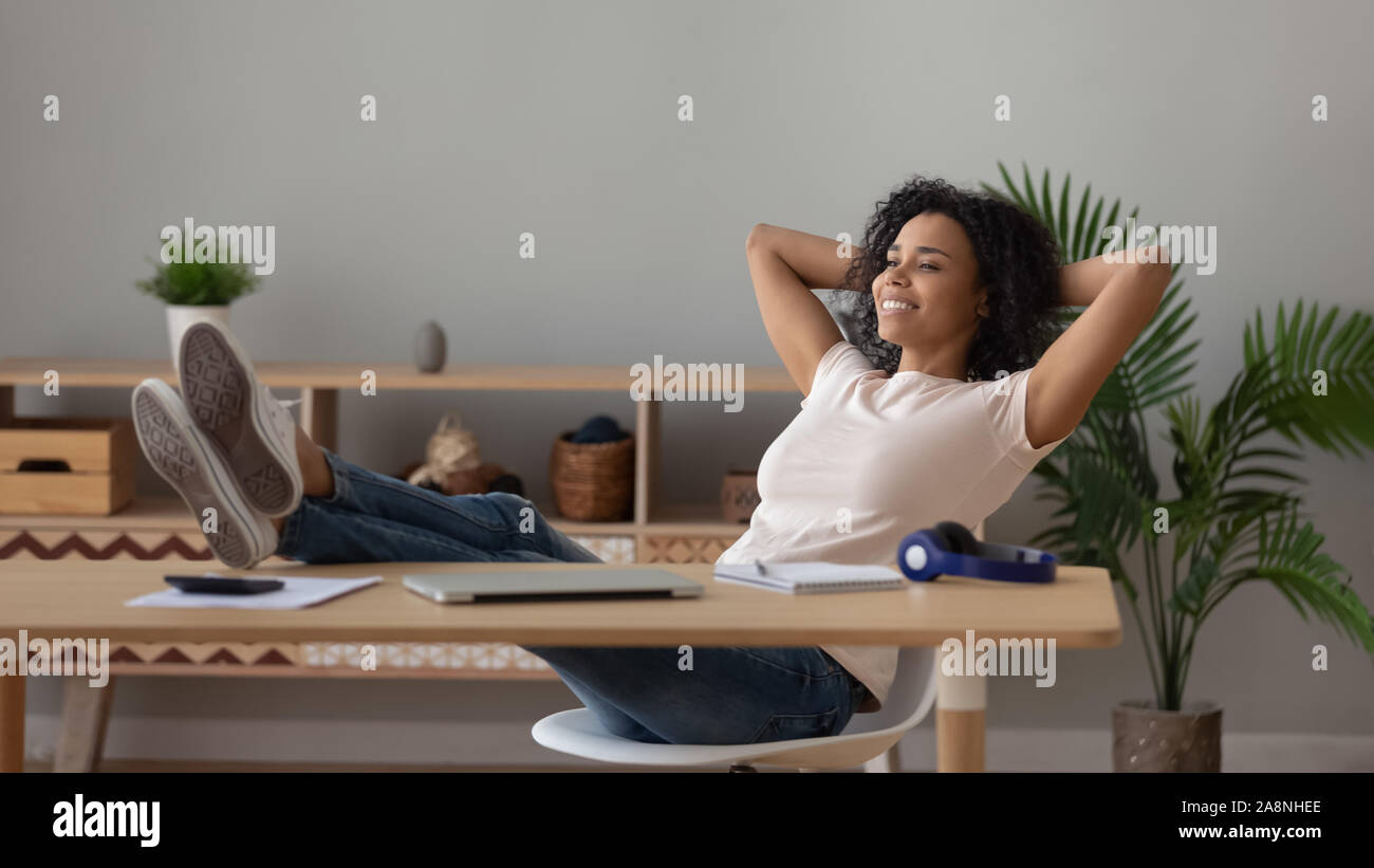 Businesswoman relaxing legs on desk hi-res stock photography and images ...