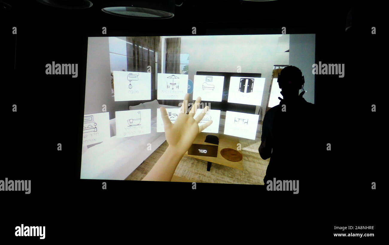 Real estate agent uses virtual reality glasses or headset to introduce ...