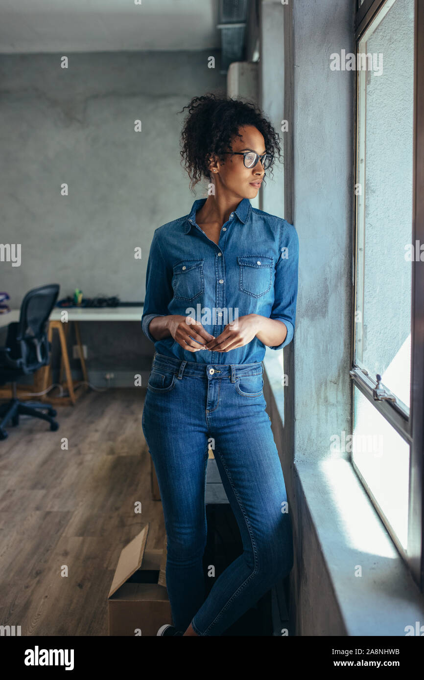 Person looking out of office window hi-res stock photography and images ...