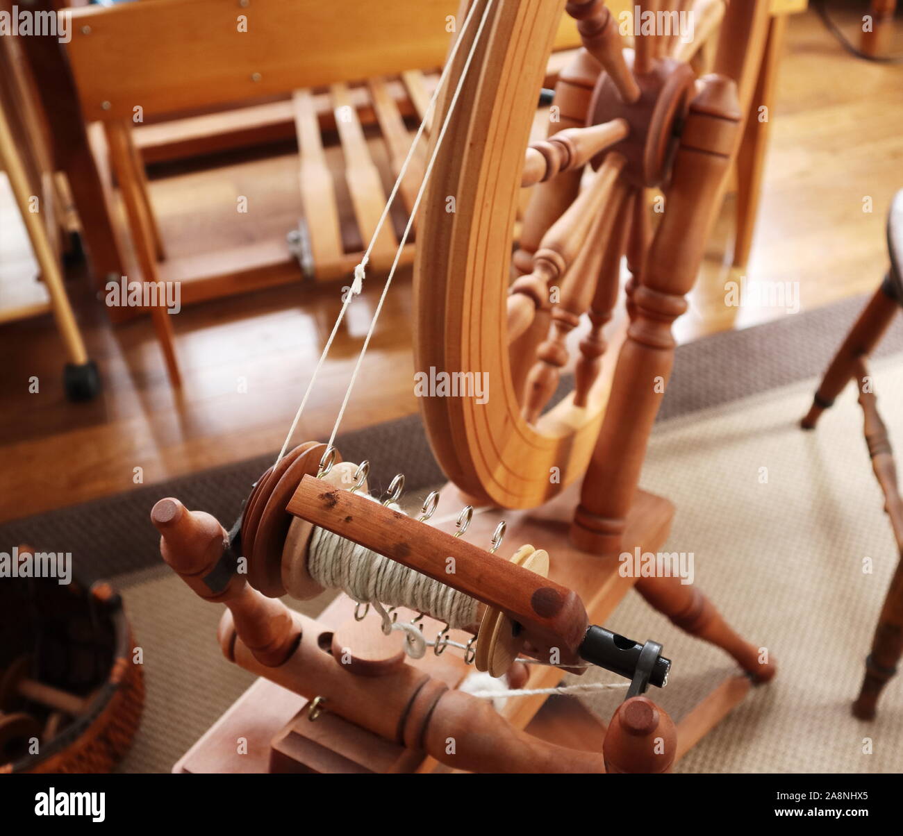 Wooden spinning wheel hi-res stock photography and images - Alamy