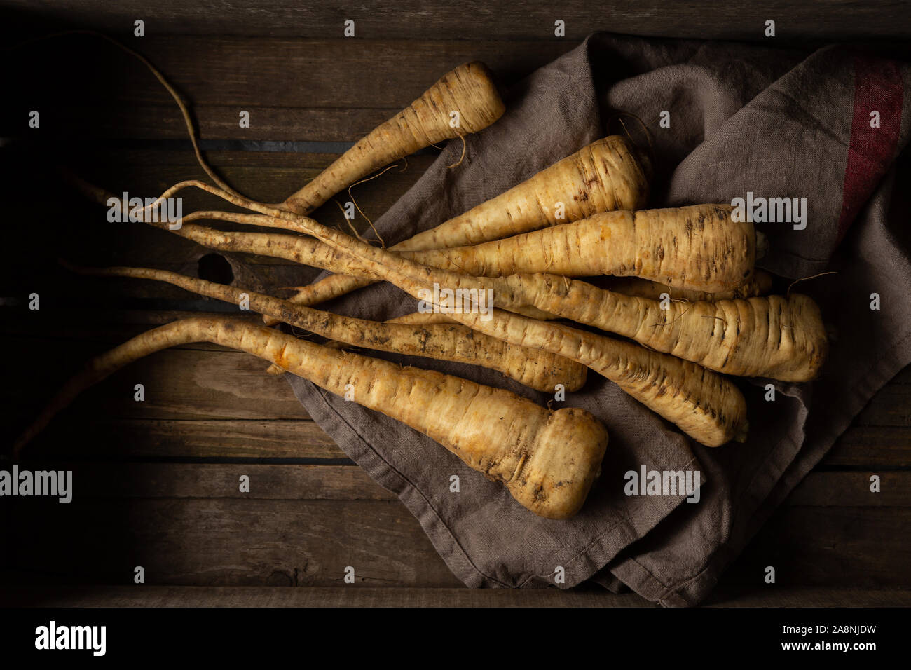 Bunch of fresh parsnip roots in crate Stock Photo - Alamy
