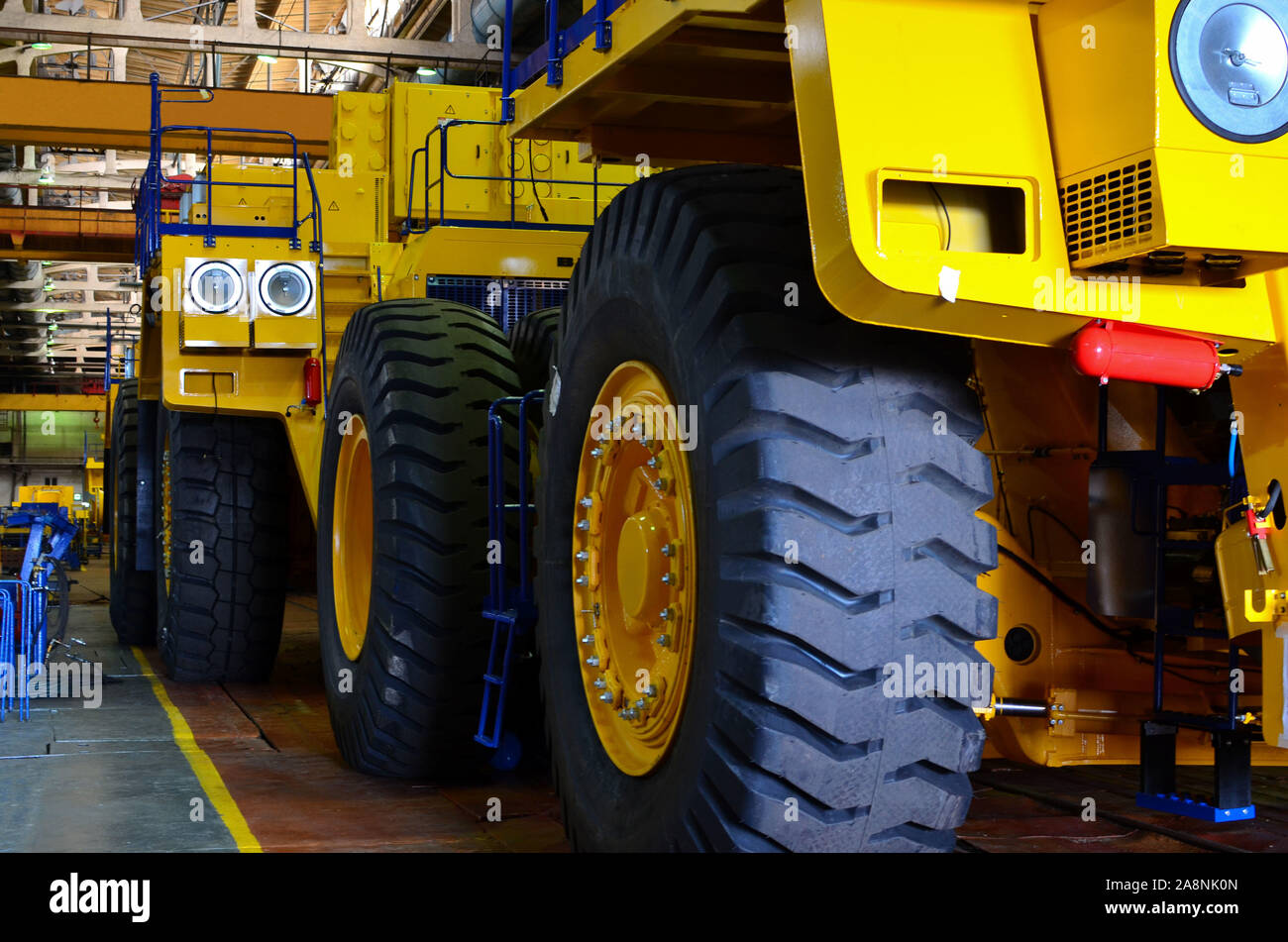 Production process of heavy mining trucks at the factory. Dump truck on ...
