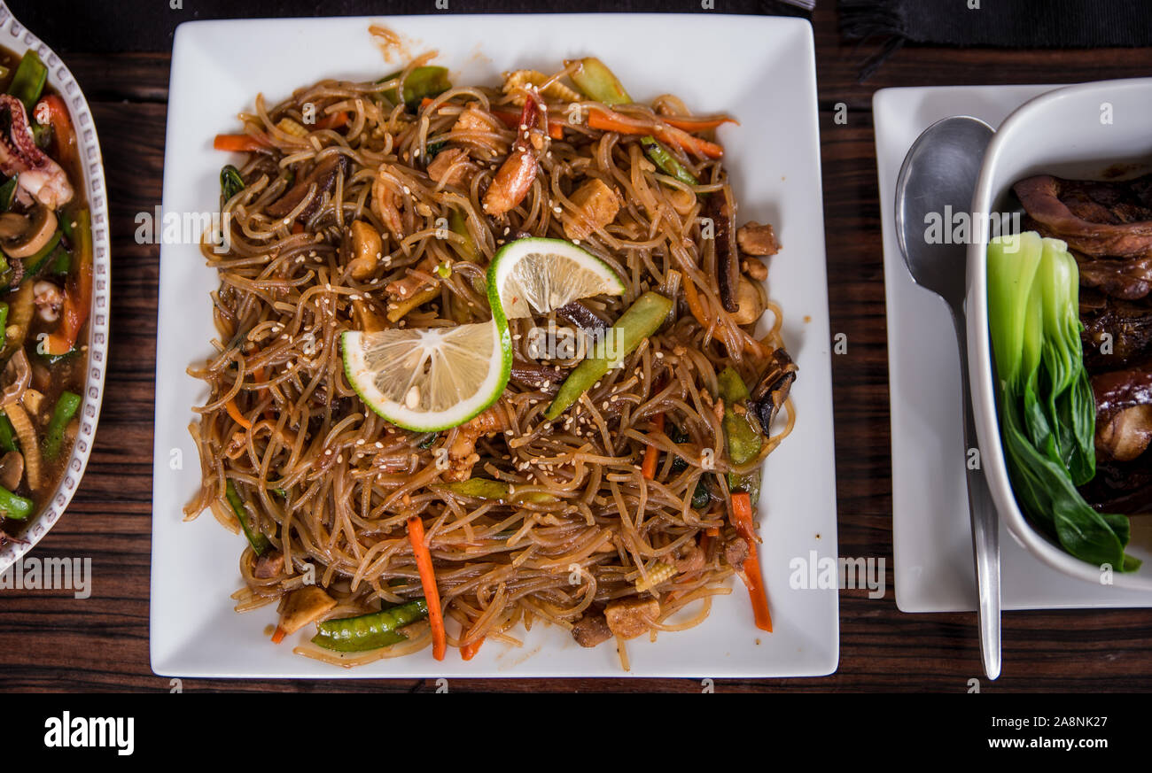 A Filipino noodle cuisine called pansit served together with the other ...