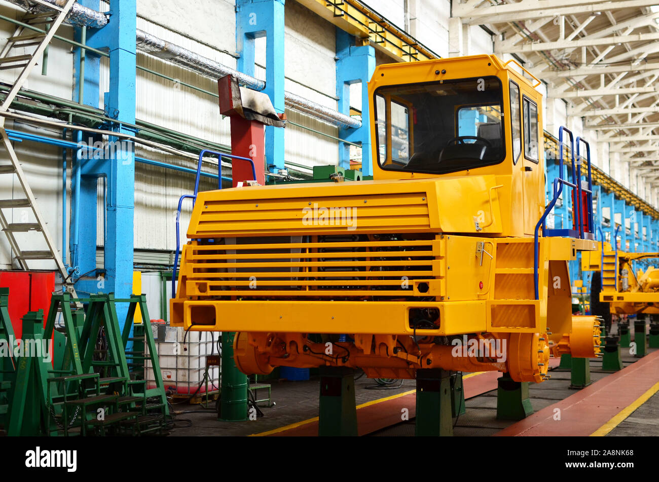 Production process of heavy mining trucks at the factory. Dump truck on ...