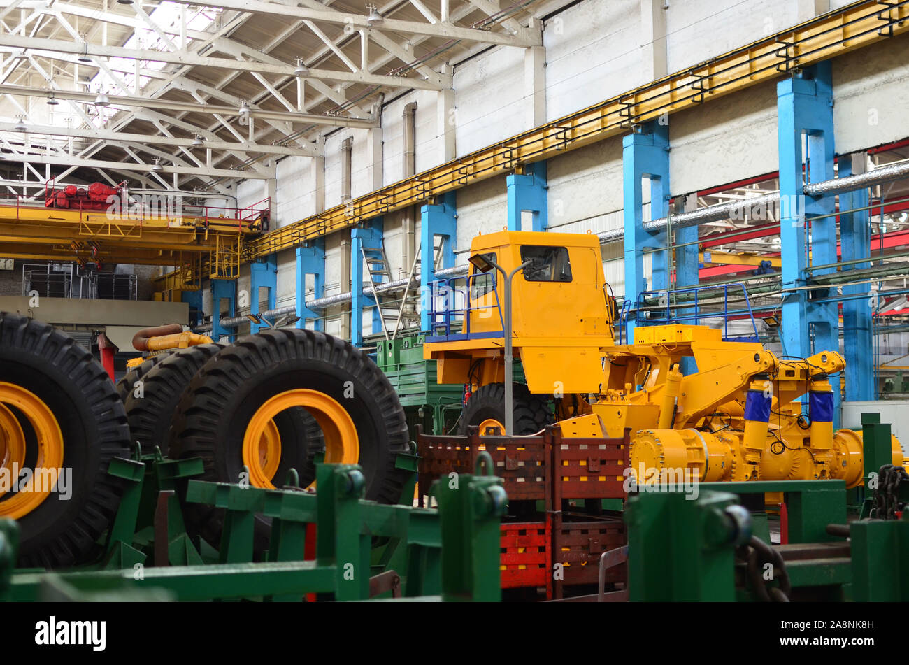 Production process of heavy mining trucks at the factory. Dump truck on ...