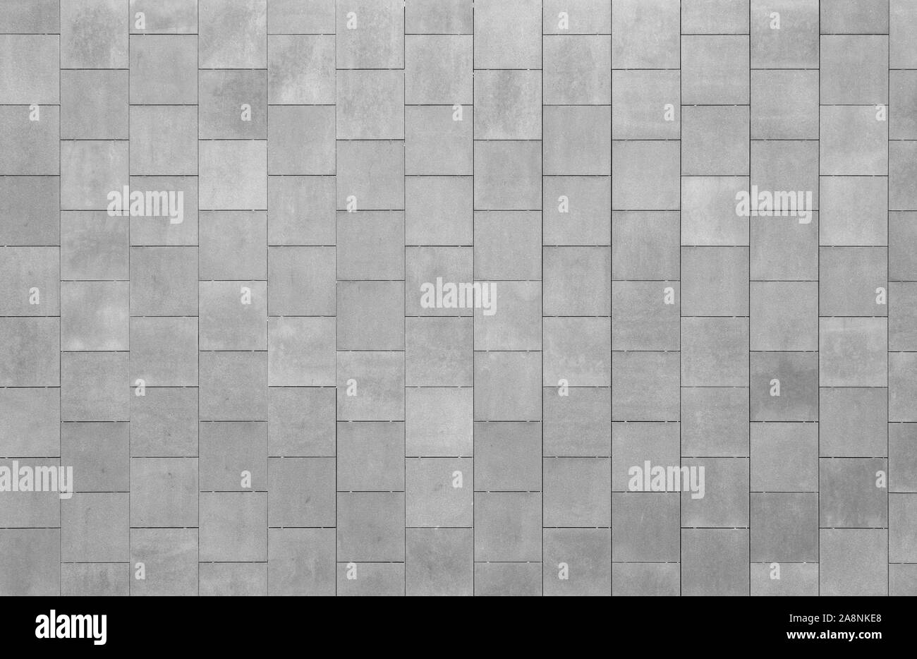 Front view of a wall made of rusty square shaped tiles or slabs. High ...