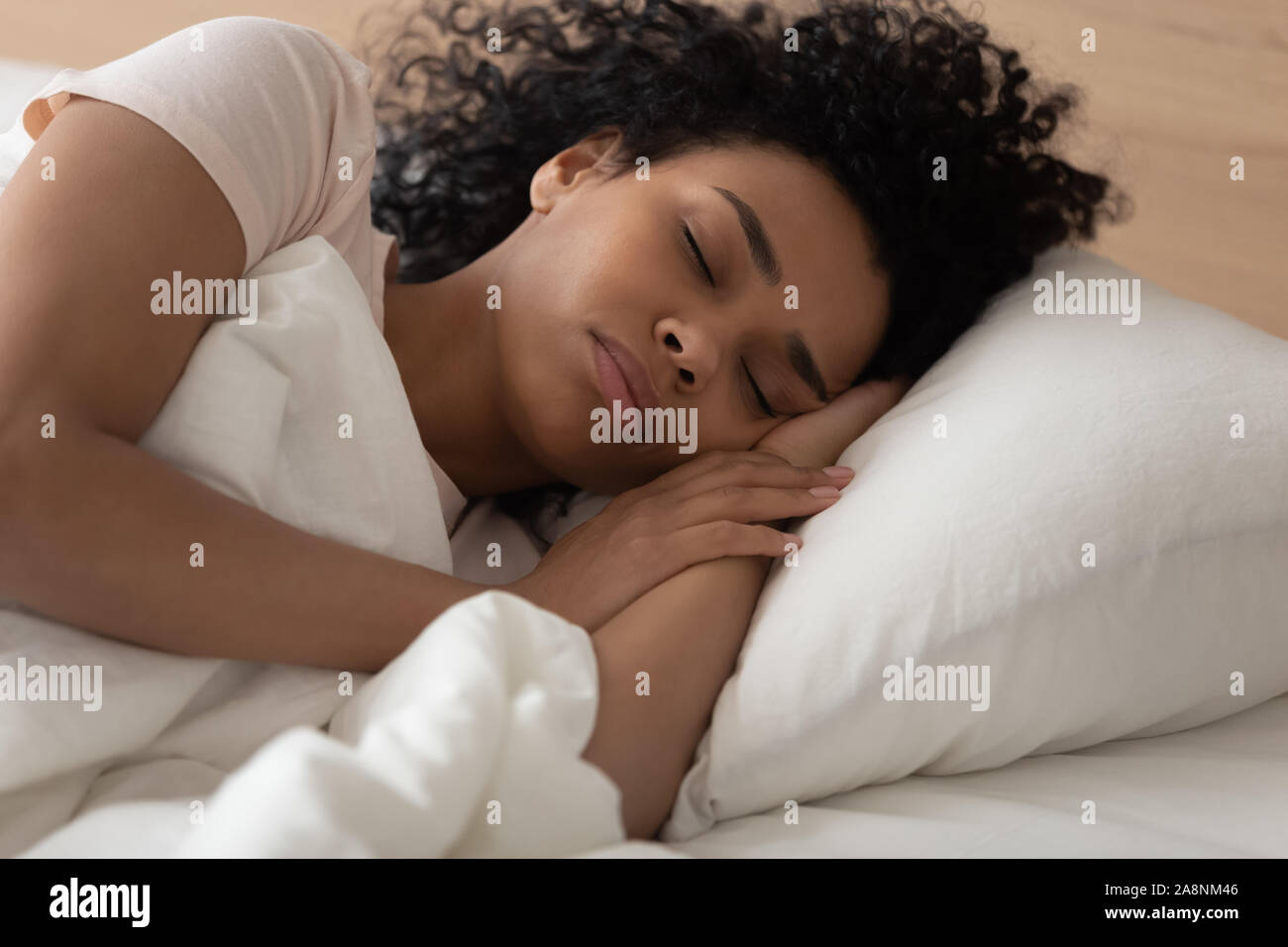 African woman sleeping on bed hi-res stock photography and images - Alamy