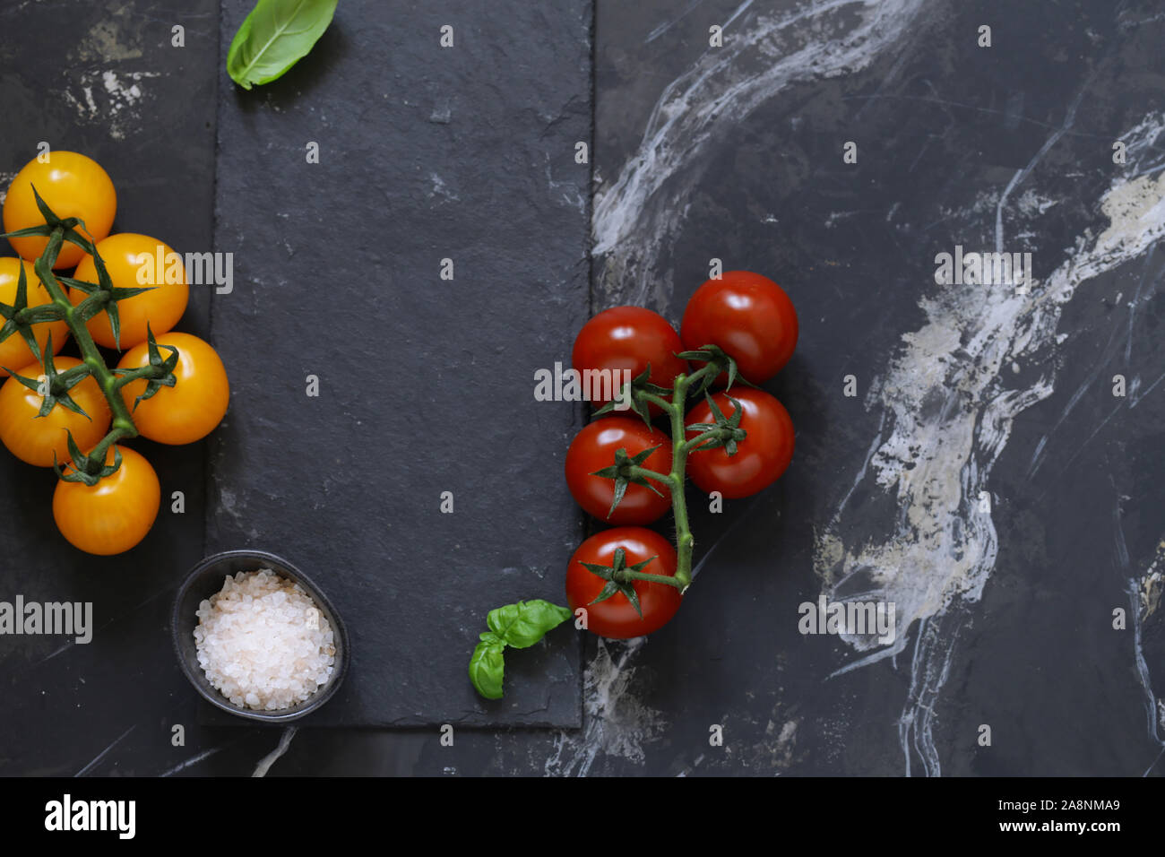 background for food menu, black graphite and tomatoes Stock Photo - Alamy