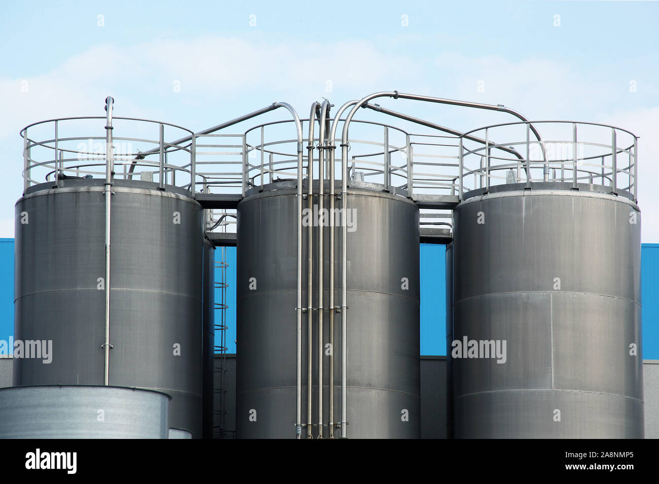 a Metallic silos of a chemical plant Stock Photo - Alamy