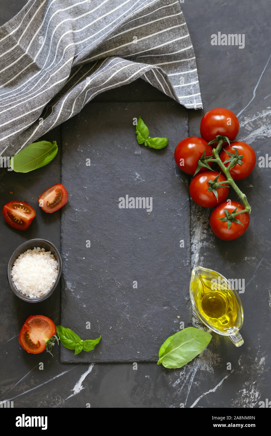 background for food menu, black graphite and tomatoes Stock Photo - Alamy