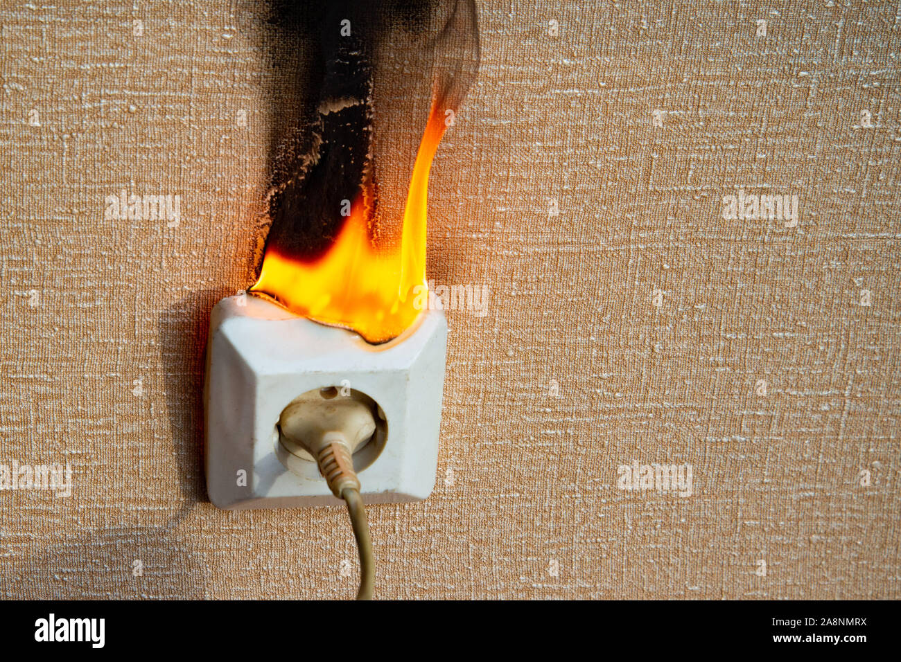 Defective wiring causes a fire. Burning electrical wiring and socket ...