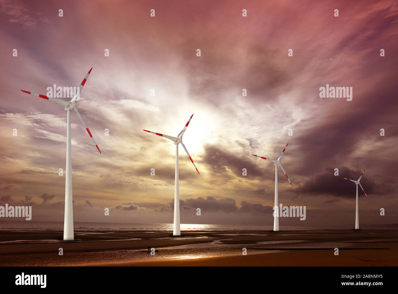 wind turbine on sunset background Stock Photo - Alamy