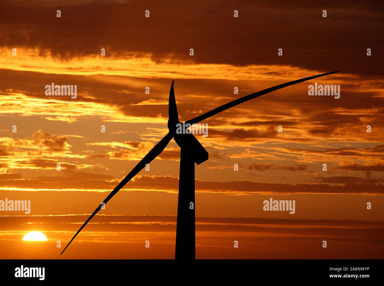 wind turbine on sunset background Stock Photo - Alamy