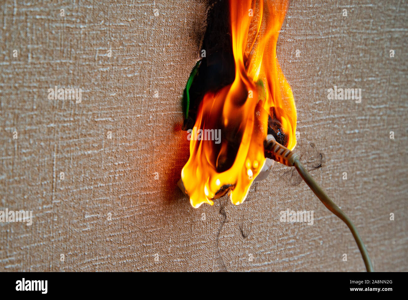 Defective wiring causes a fire. Burning electrical wiring and socket ...