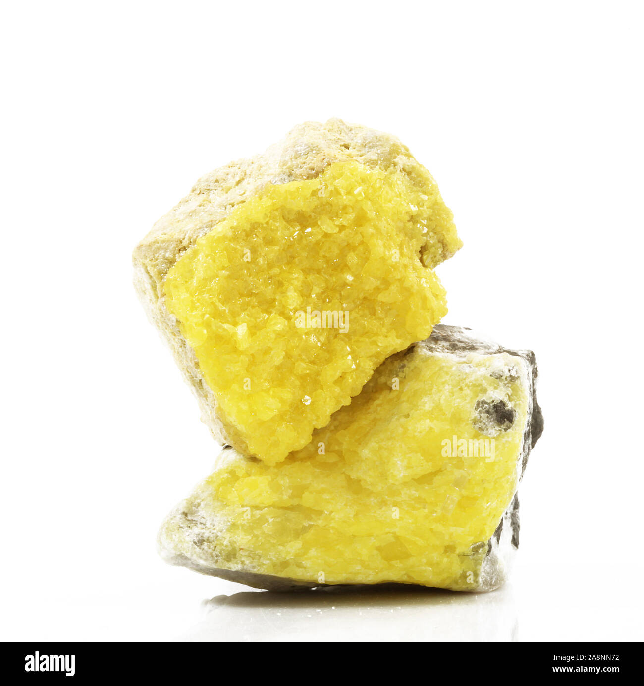 Sulphur crystals on white background Stock Photo - Alamy