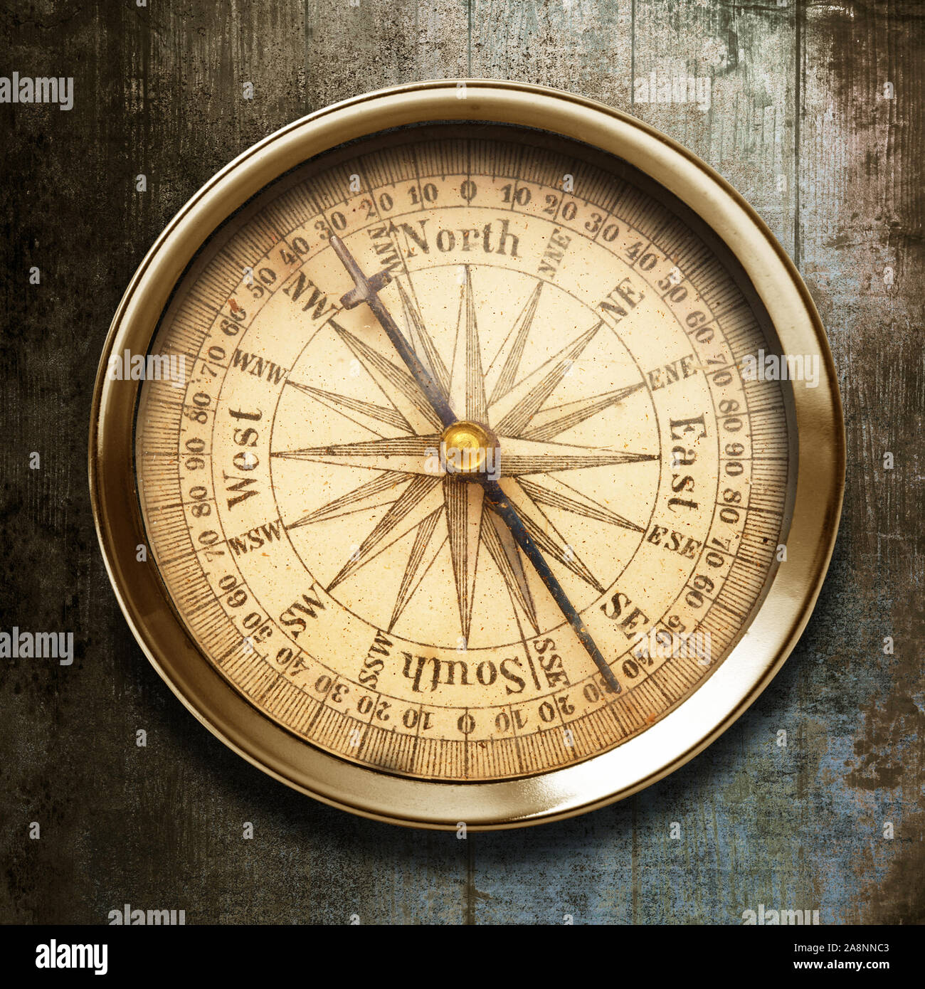 old compass on vintage background Stock Photo - Alamy