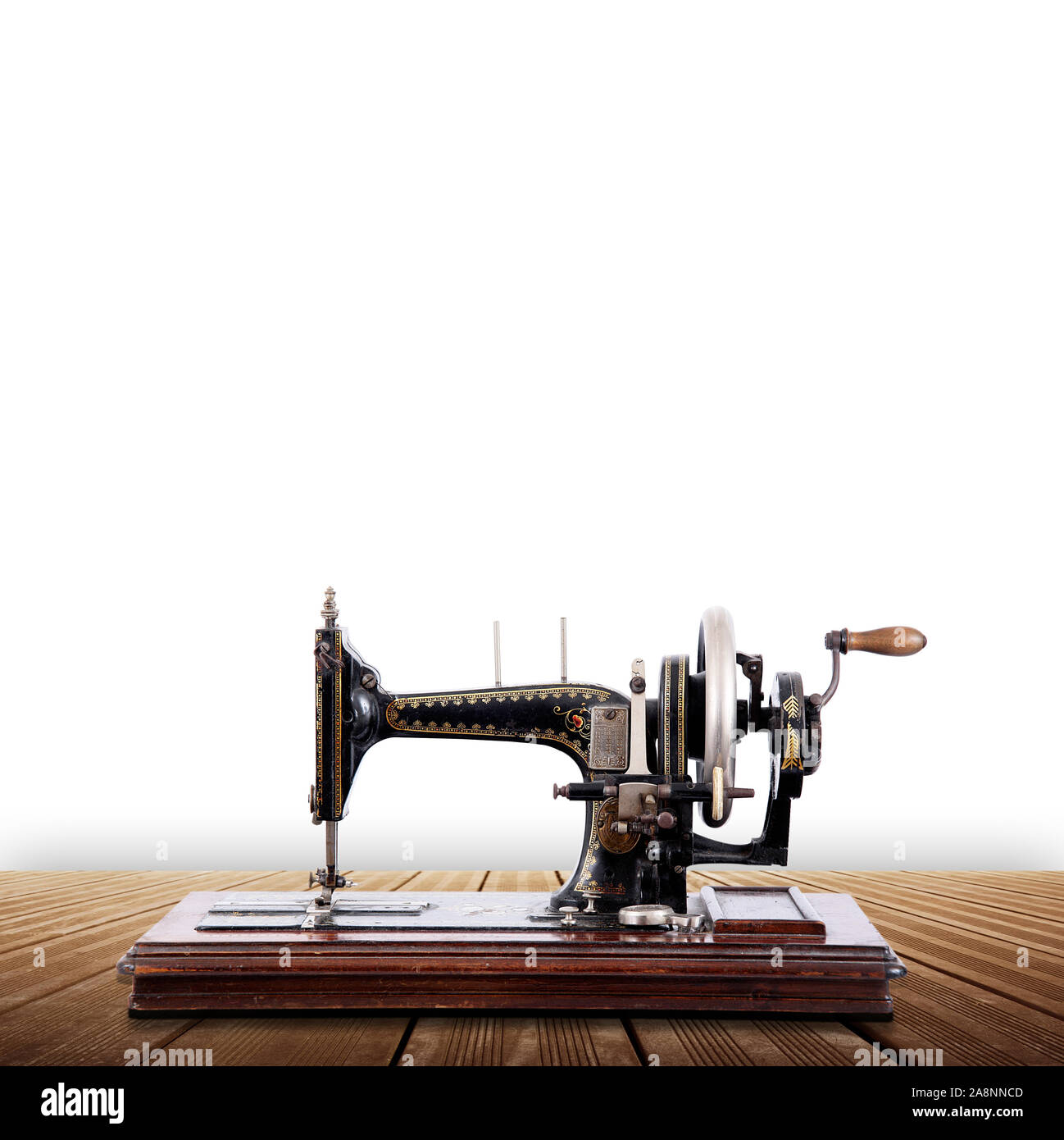 old sewing machine on white background Stock Photo - Alamy