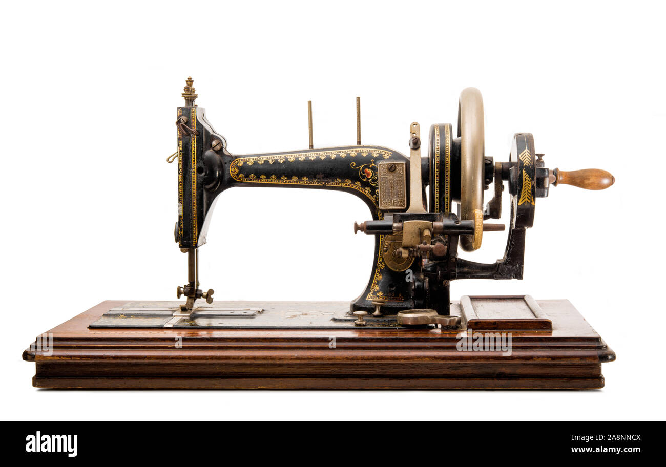 old sewing machine on white background Stock Photo - Alamy