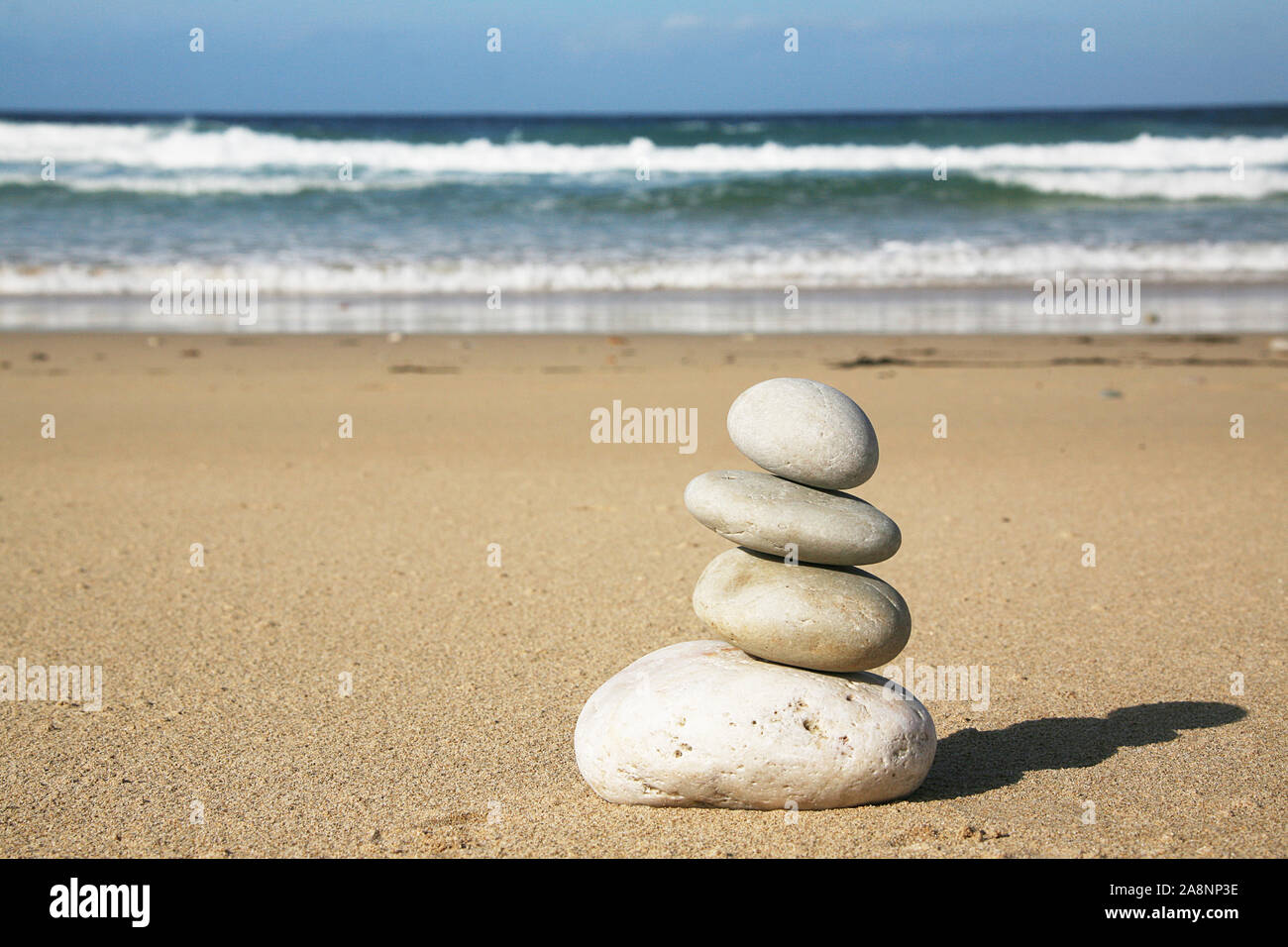 stacked stones on the beach Stock Photo - Alamy