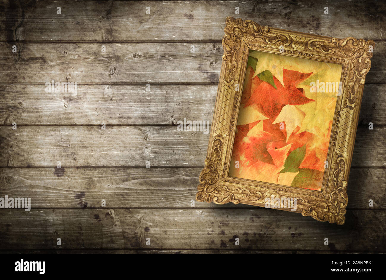 Old frame hanging on wooden wall Stock Photo - Alamy