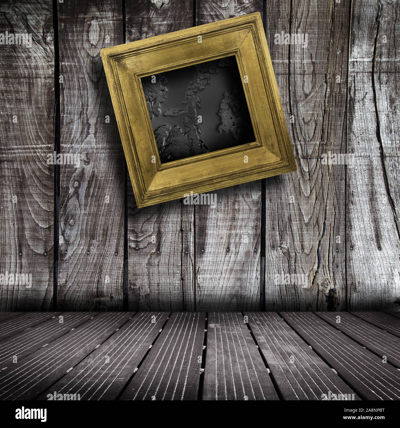 Old frame hanging on wooden wall Stock Photo - Alamy