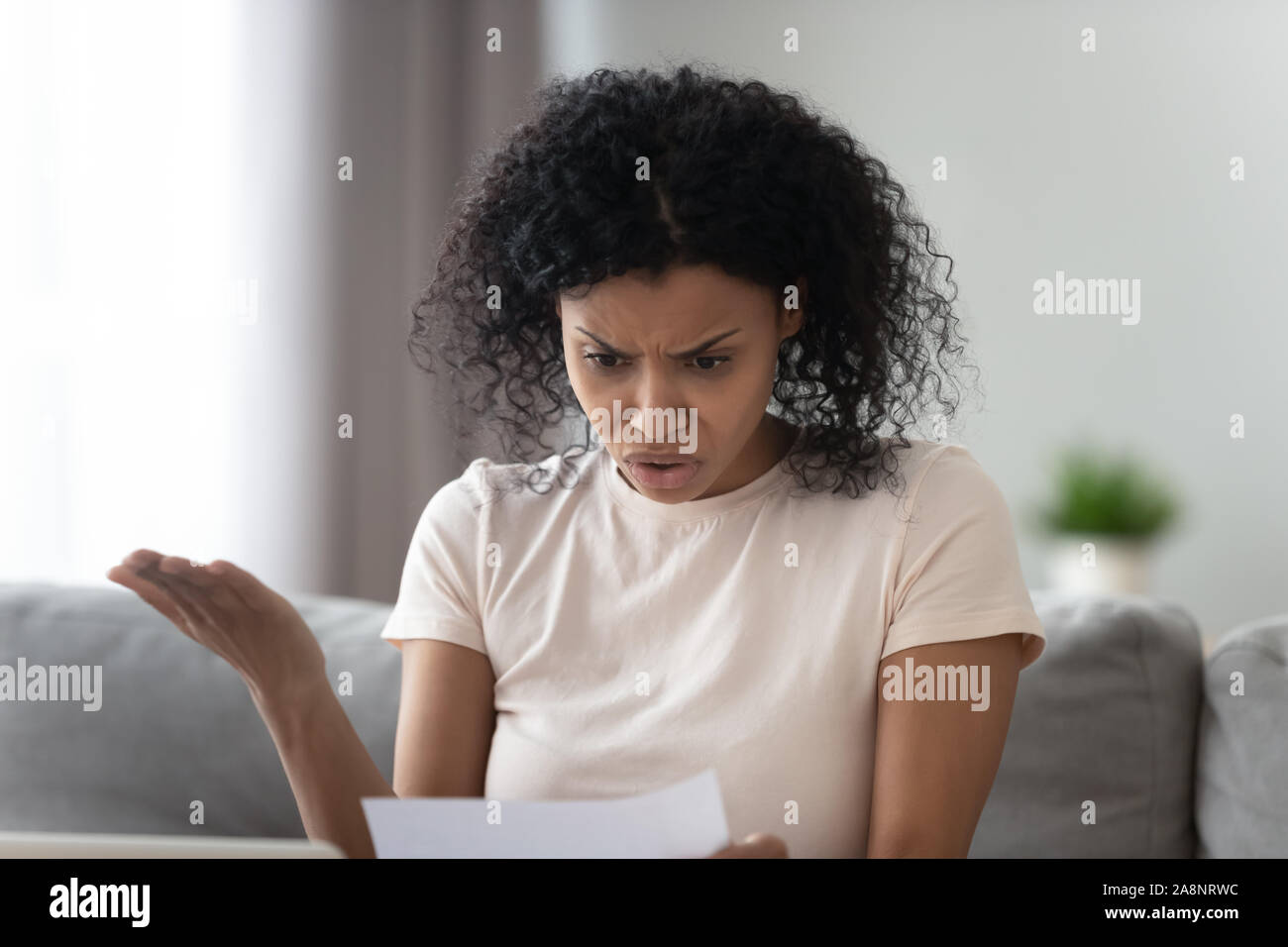 Black woman reading letter hi-res stock photography and images - Alamy