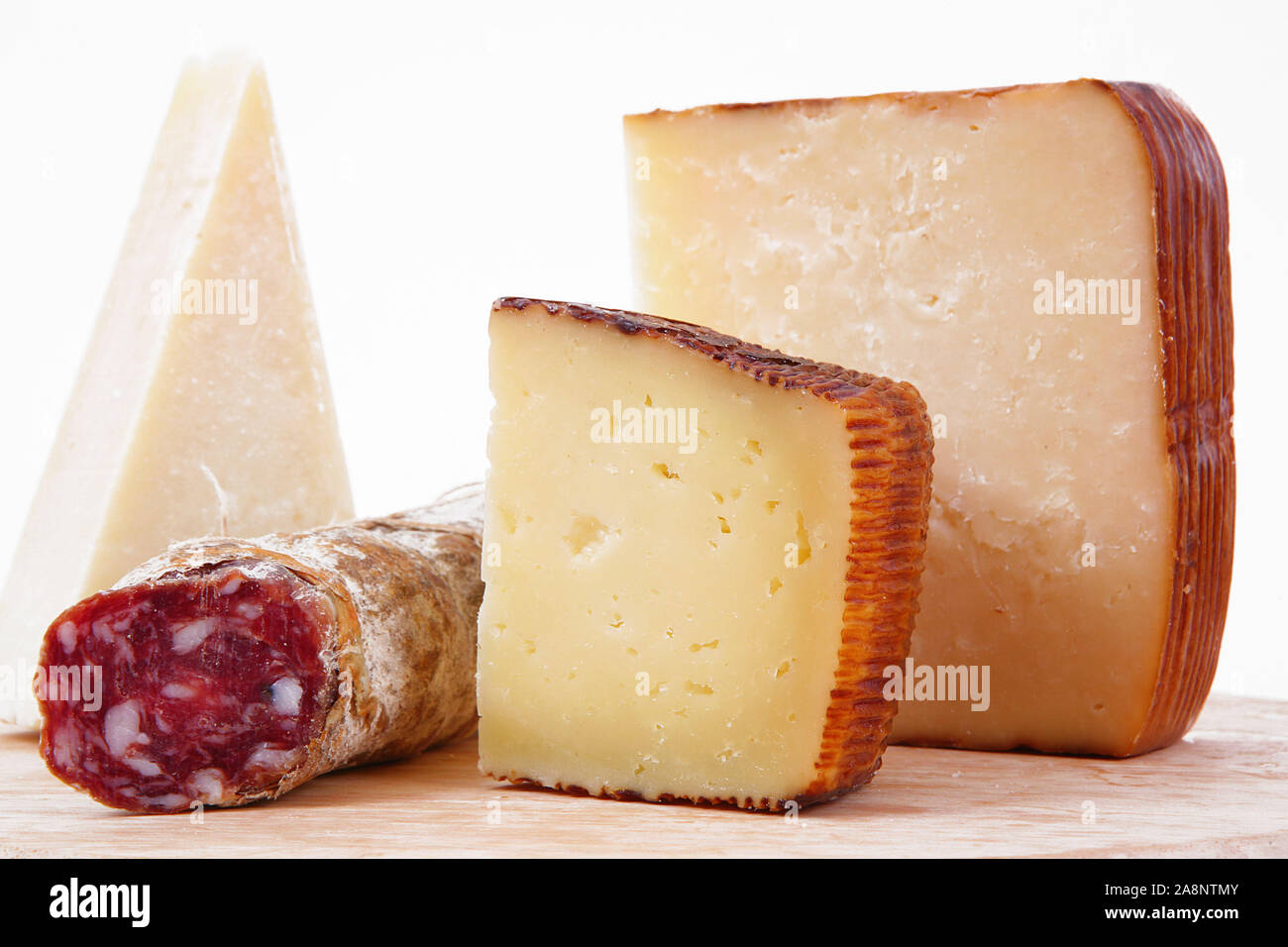 original italian cheese chopping on white background Stock Photo - Alamy