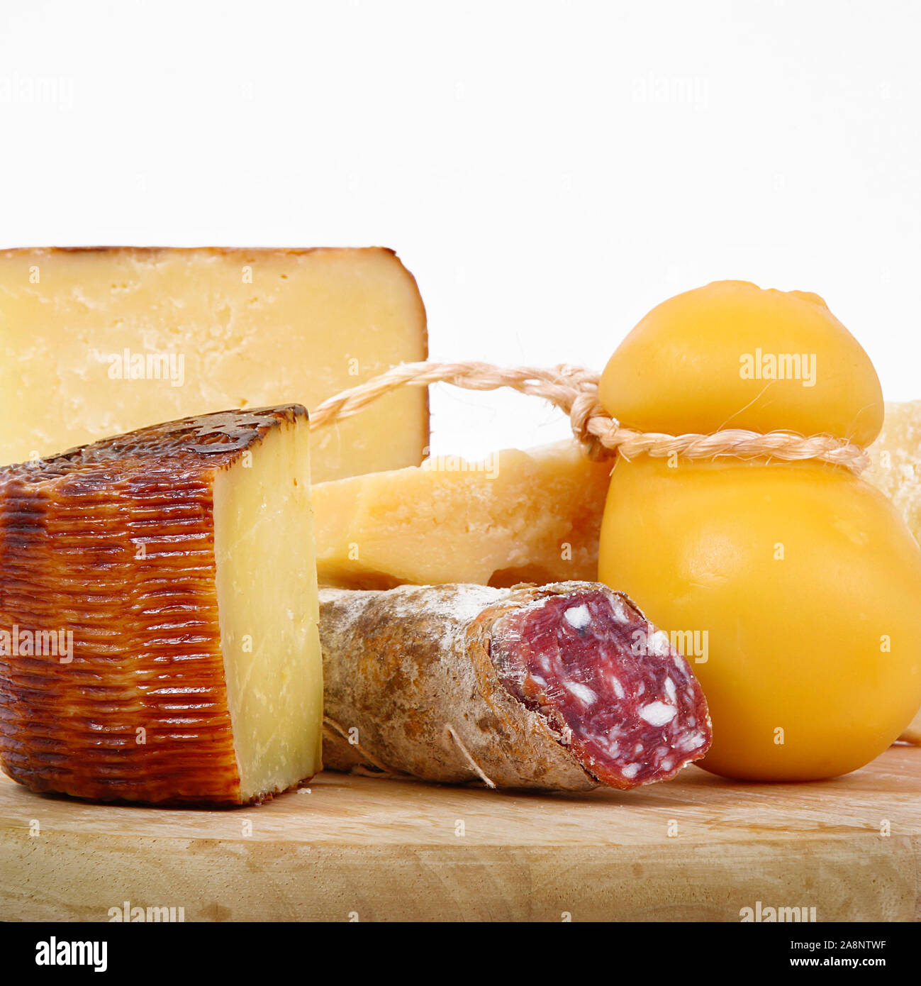 original italian cheese chopping on white background Stock Photo - Alamy