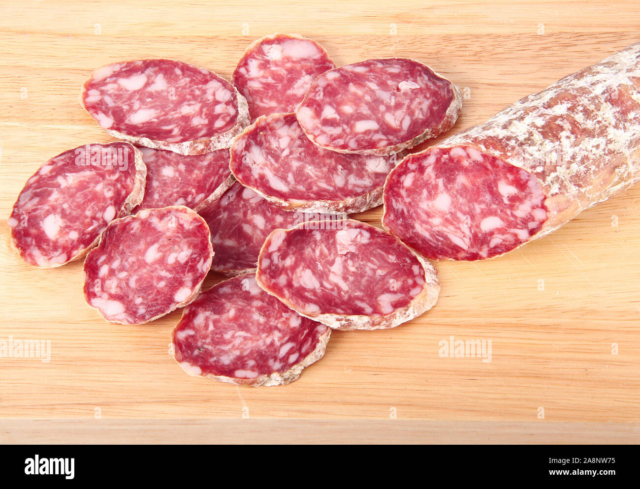 italian salami slices on chopping board background Stock Photo - Alamy
