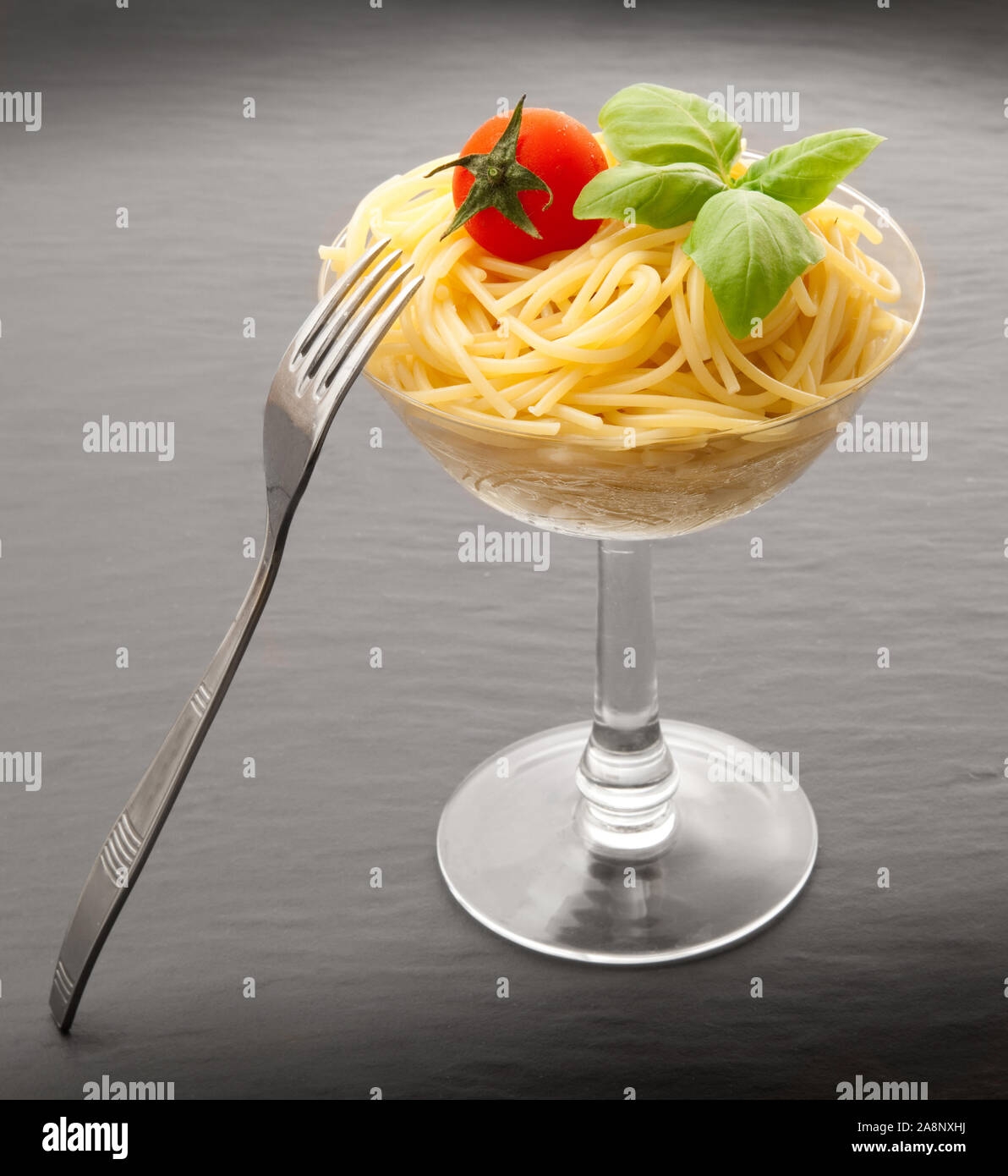 original italian spaghetti in glass Stock Photo - Alamy