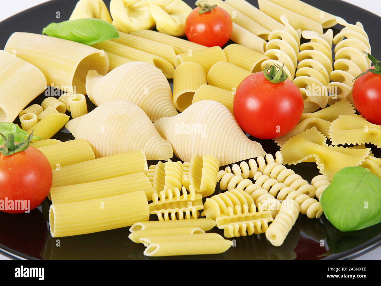 original italian pasta with basil and tomato Stock Photo - Alamy