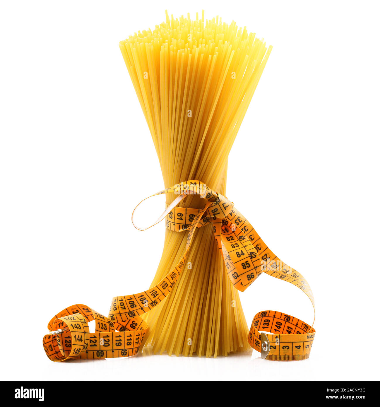 italian raw pasta on white background with metre Stock Photo - Alamy