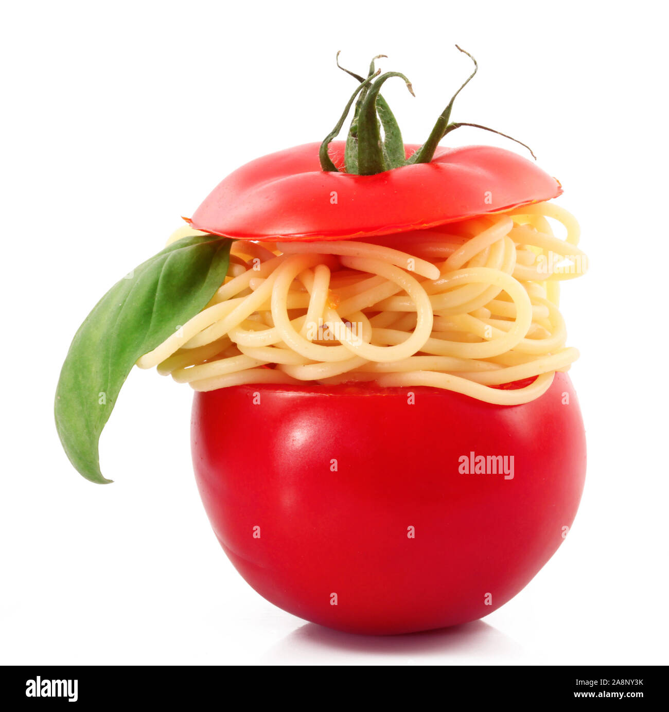 tomato stuffed with italian pasta and basil Stock Photo - Alamy