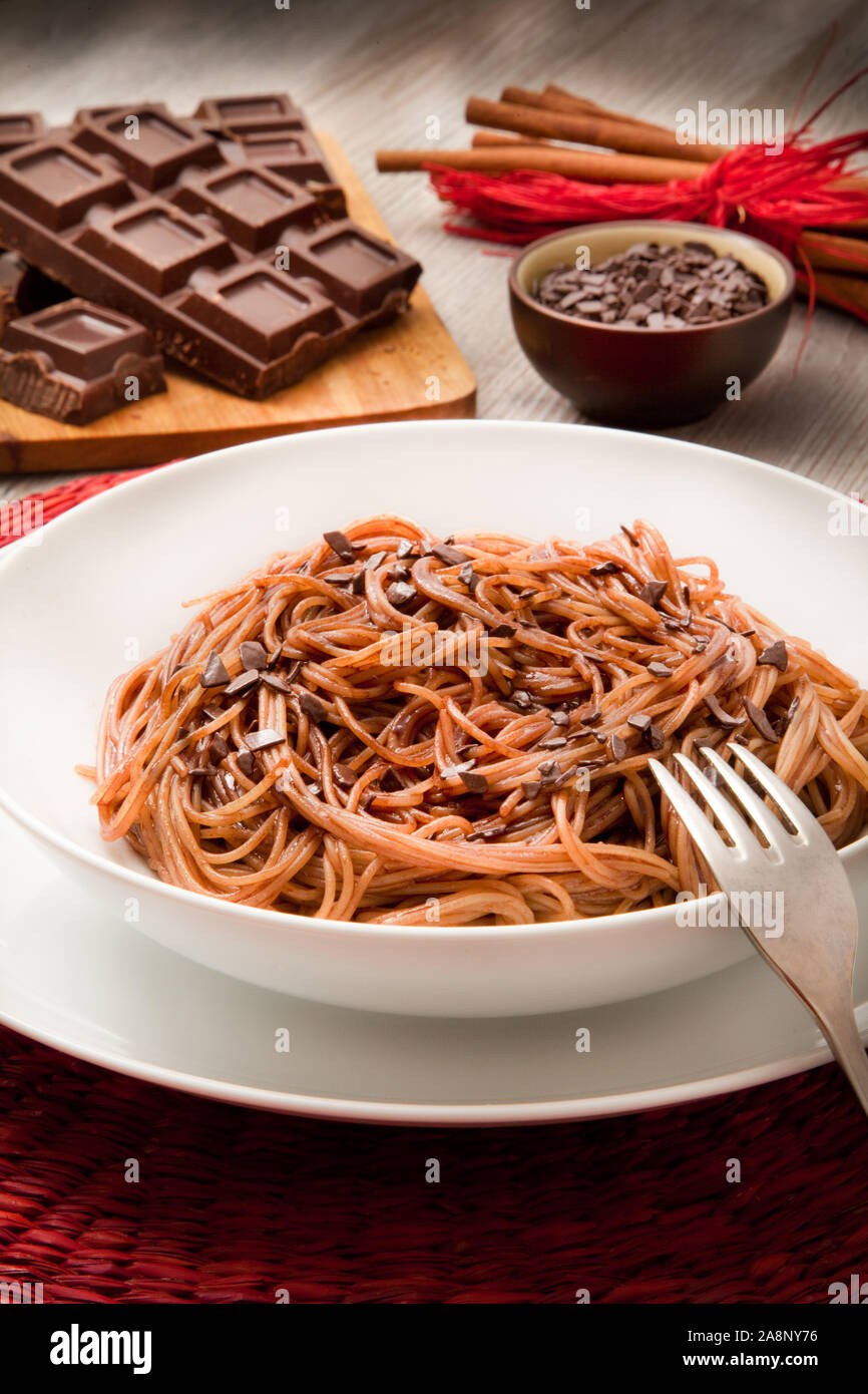 original italian spaghetti with chocolate and pepper Stock Photo - Alamy