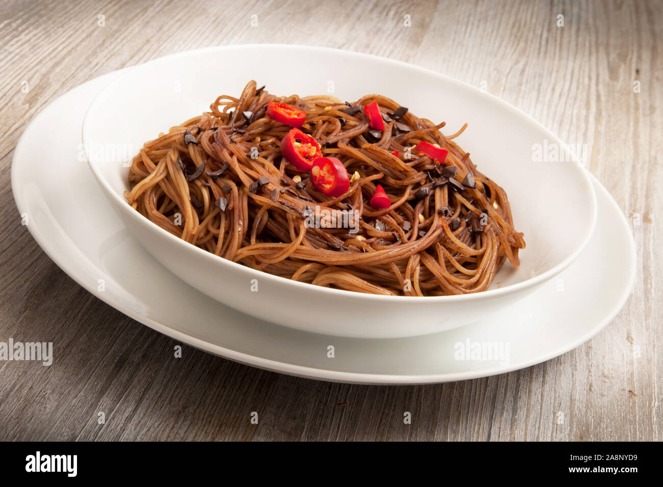 original italian spaghetti with chocolate and pepper Stock Photo - Alamy