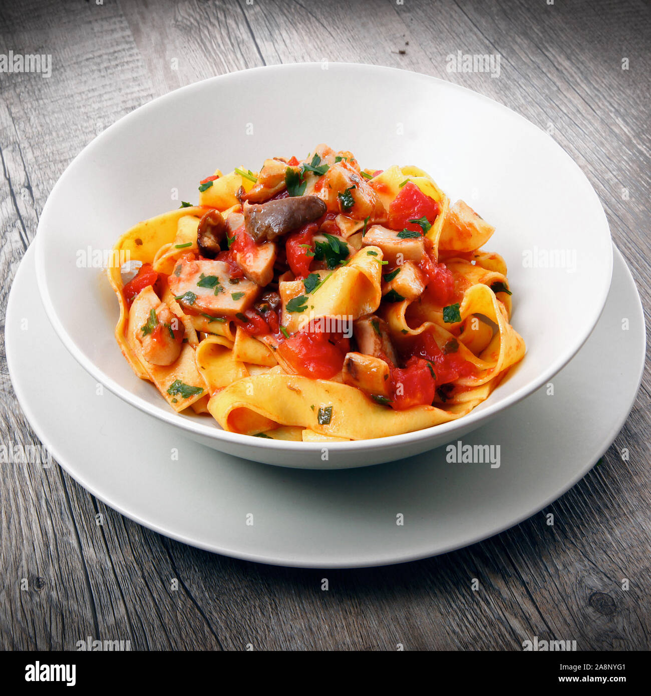 original italian tagliatelle with mushroom and tomato Stock Photo - Alamy