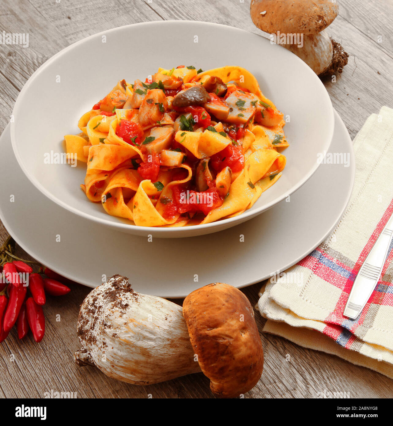 original italian tagliatelle with mushroom and tomato Stock Photo - Alamy