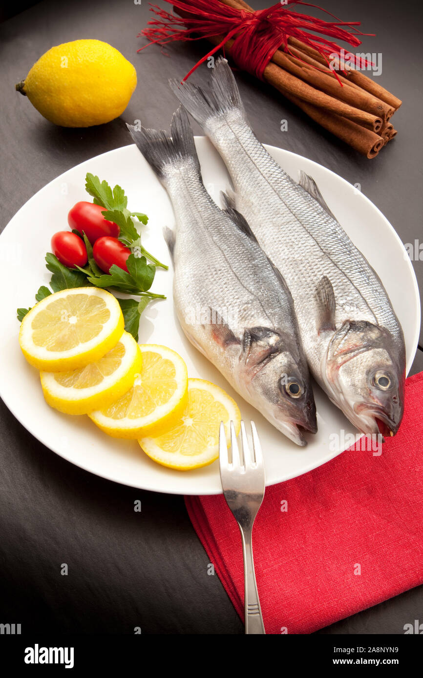 isolated fresh bass dish on stone background Stock Photo - Alamy