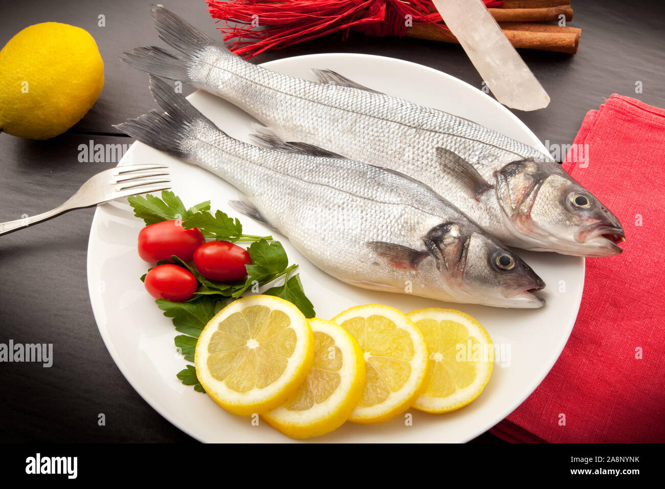 isolated fresh bass dish on stone background Stock Photo - Alamy