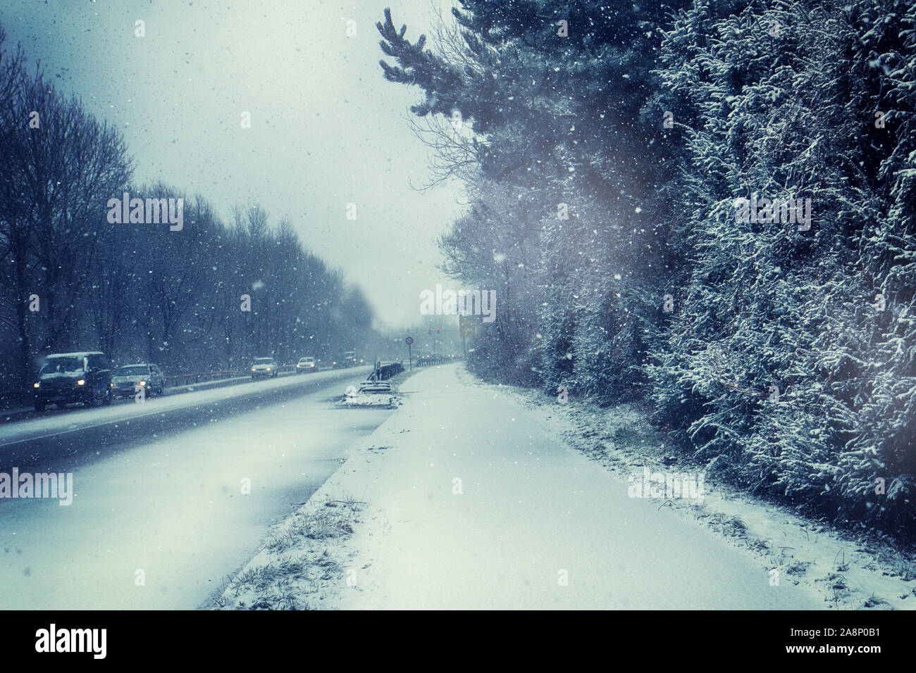 Snowfall on the road hi-res stock photography and images - Alamy
