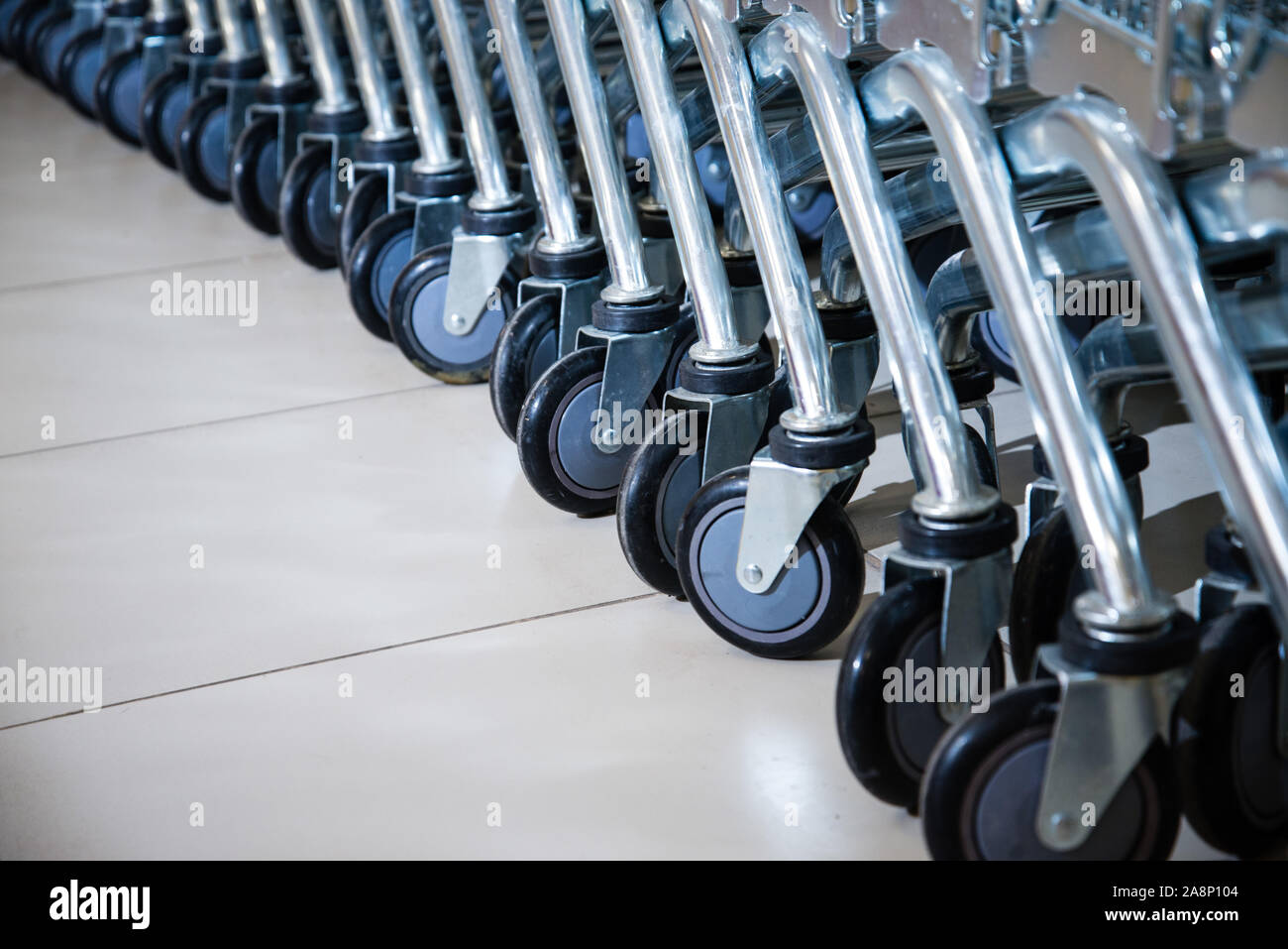 Carts lined up together. Many wheels from shopping carts Stock Photo ...
