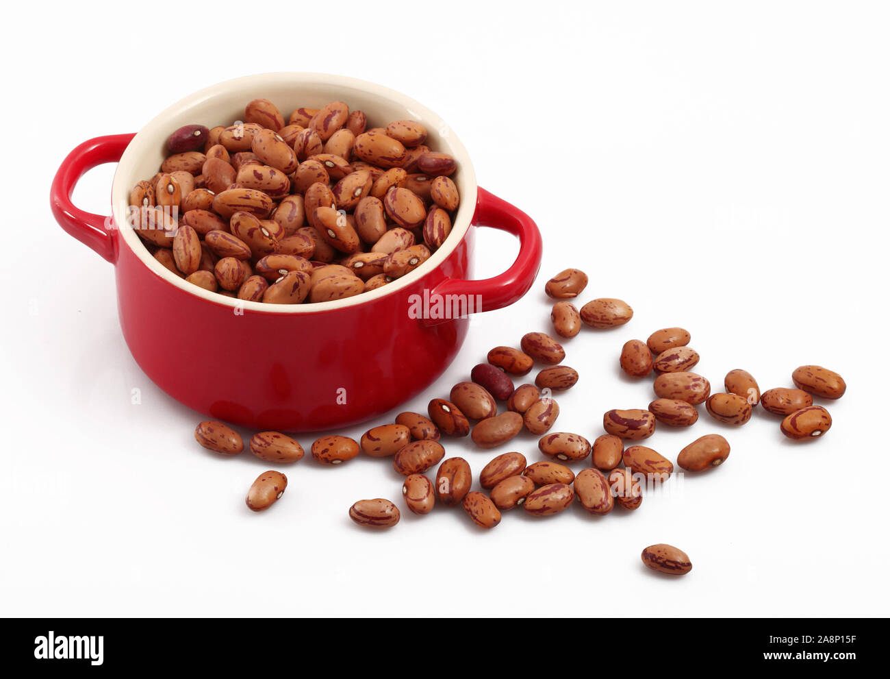 dry beans in pot on white background Stock Photo - Alamy