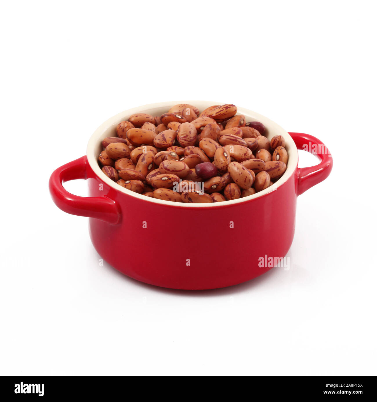 dry beans in pot on white background Stock Photo - Alamy