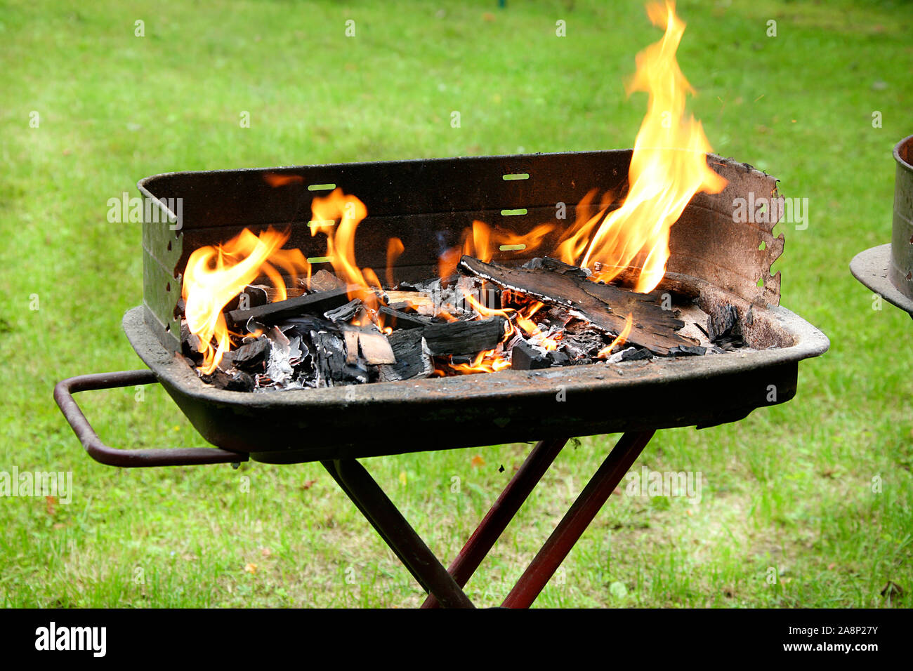 a burning barbecue ready for cooking Stock Photo - Alamy