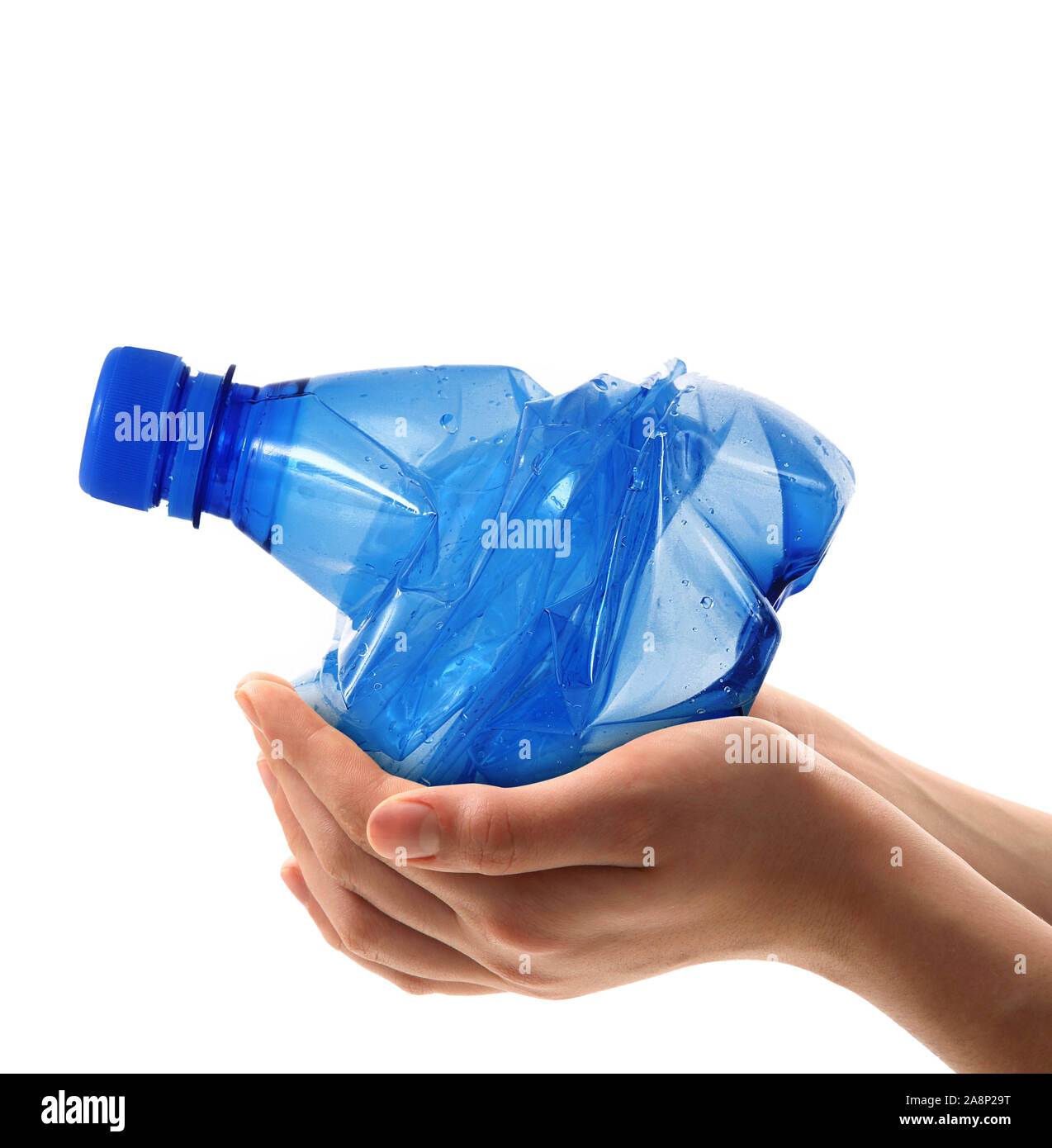 plastic bottle hand-held on white background Stock Photo - Alamy