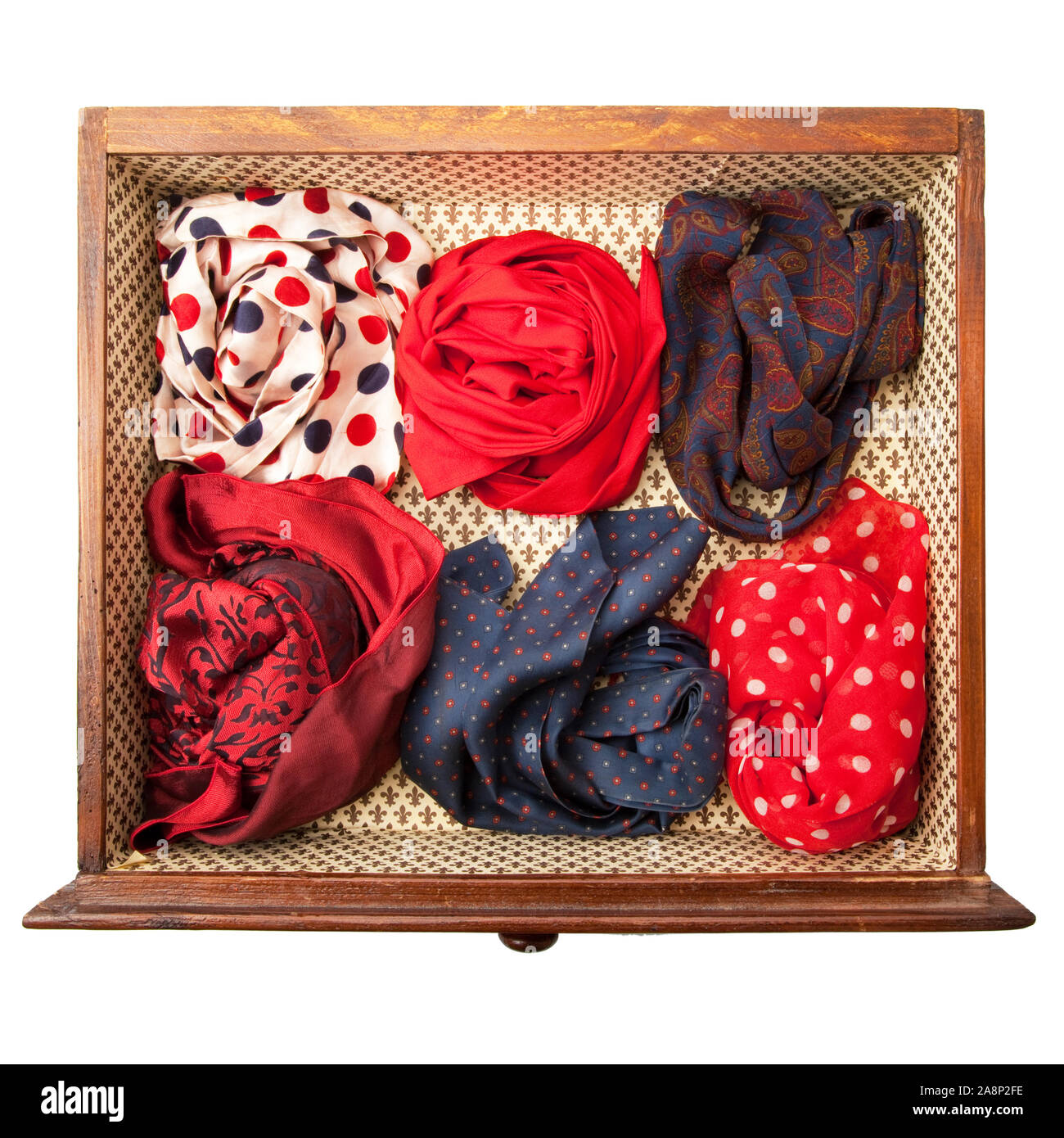 Drawer with clothes seen from above on white background Stock Photo - Alamy