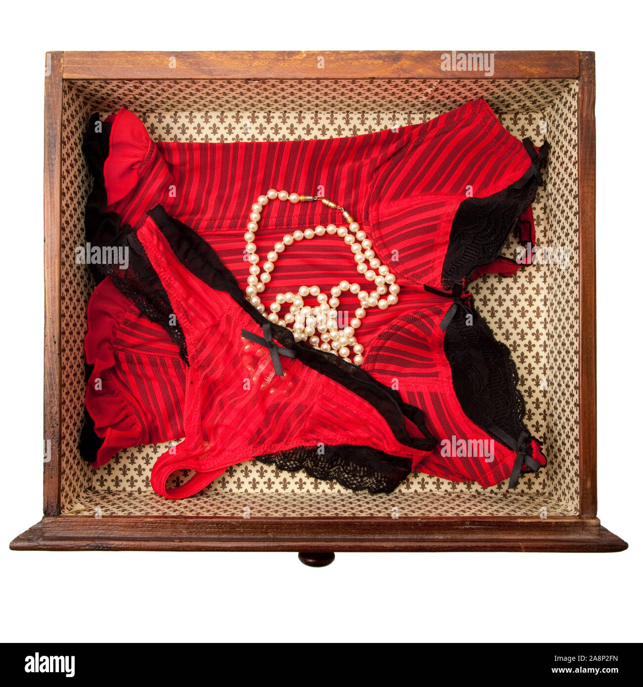 Drawer with clothes seen from above on white background Stock Photo - Alamy