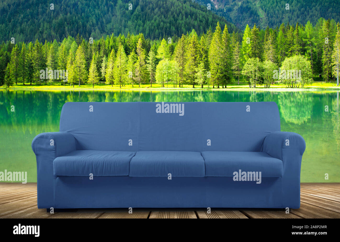 Blue sofa on nature background Stock Photo - Alamy