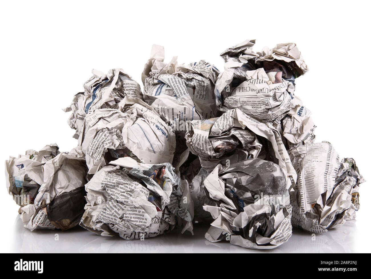 Newspapers balls on white background Stock Photo - Alamy