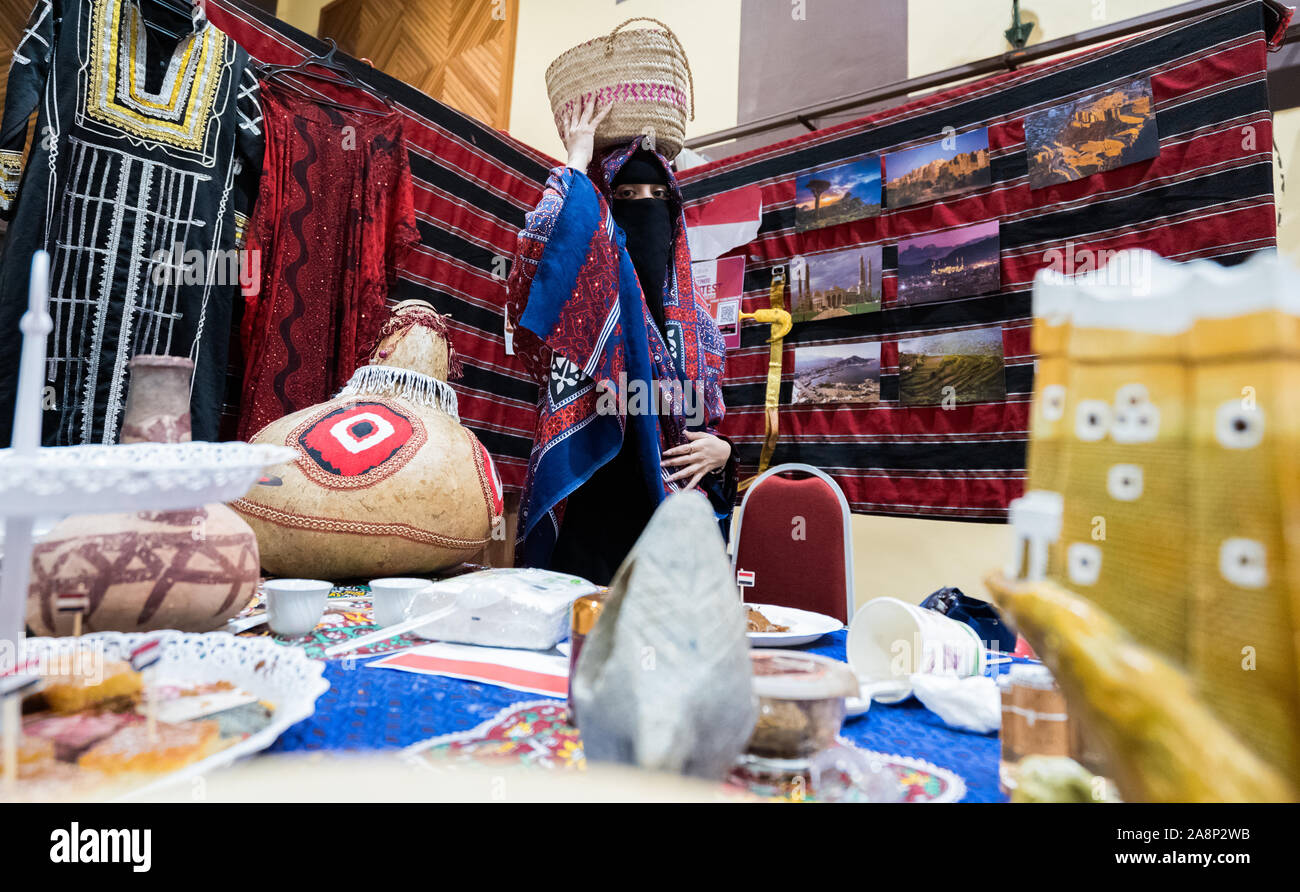 Yemeni women traditional dress cloth surrounded by some souvenirs and ...